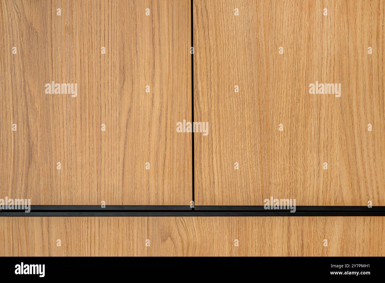 Texture of wood veneer cabinets with black metal handles as background ...