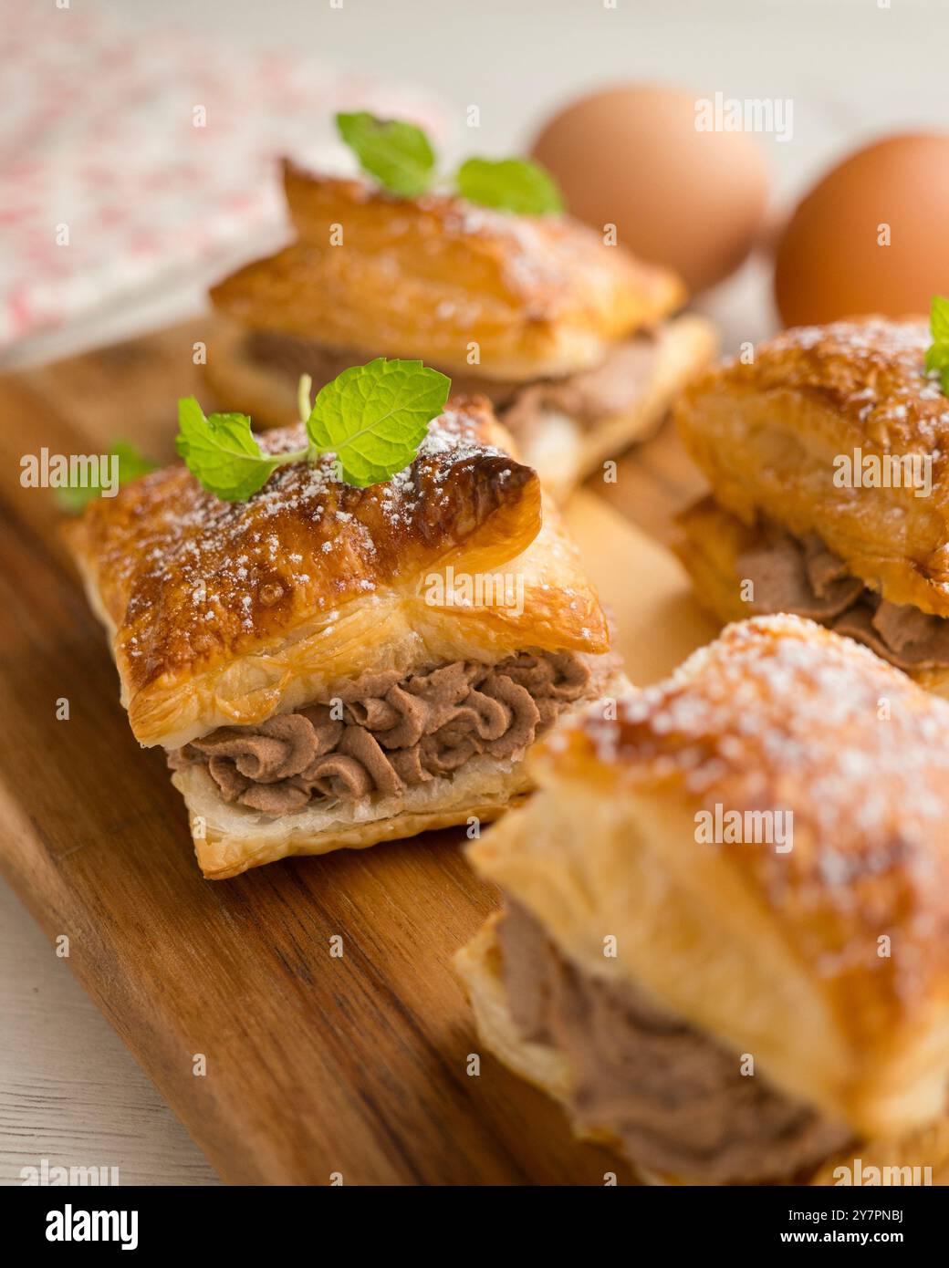 Miguelitos with chocolate truffle cream. Spanish chocolate puff pastry ...