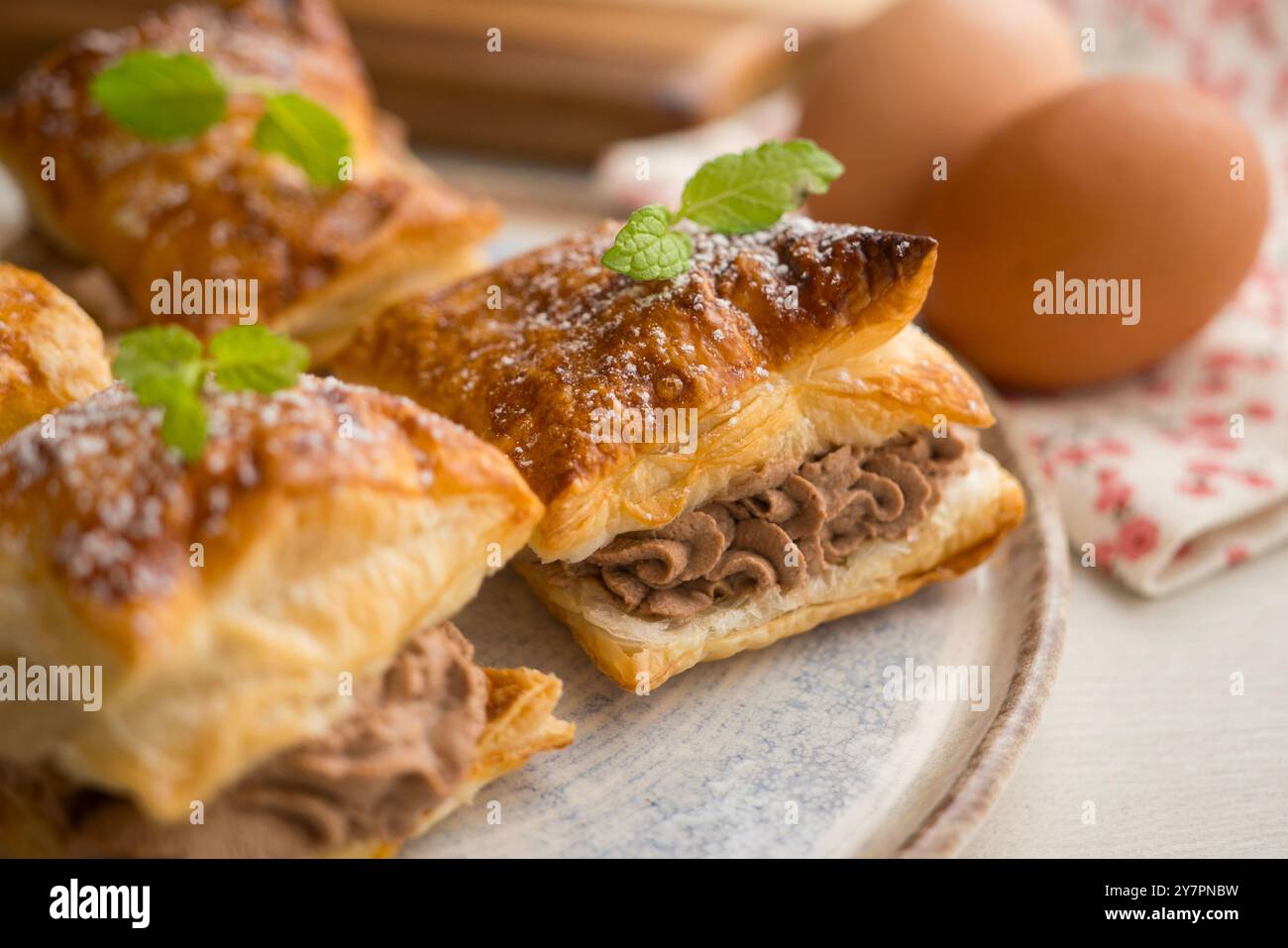 Miguelitos with chocolate truffle cream. Spanish chocolate puff pastry ...