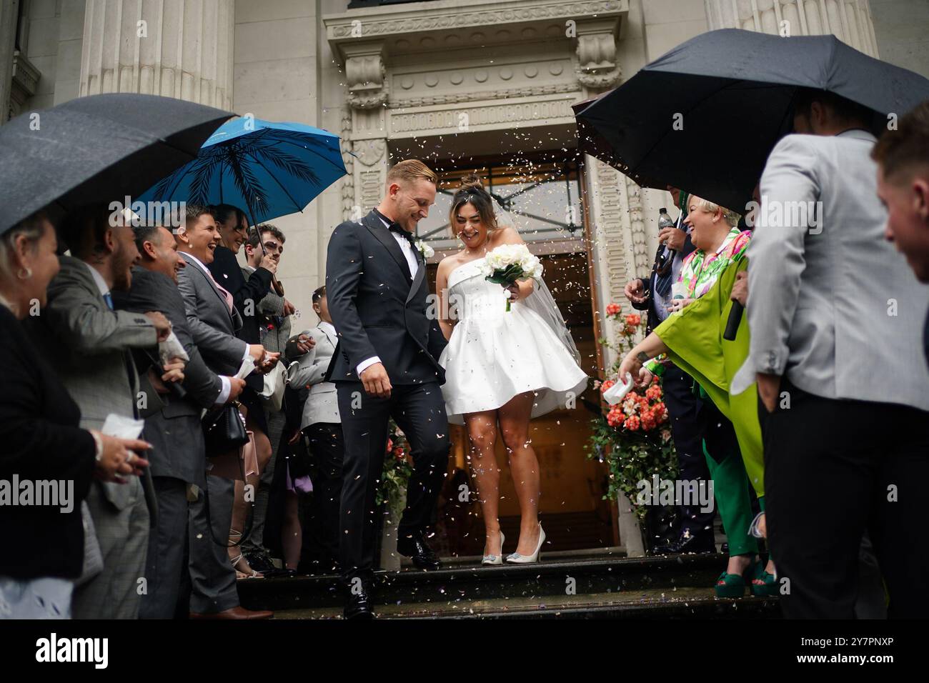 Newly married couple Jack and Katie Webster walk down the steps at Old ...