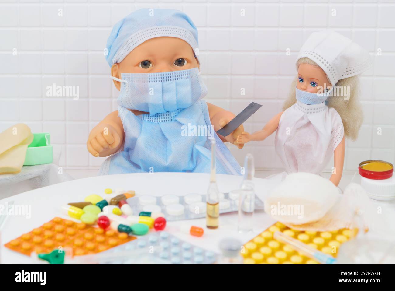 Toys medical scene. Doctor and nurse during working hours at table with ...