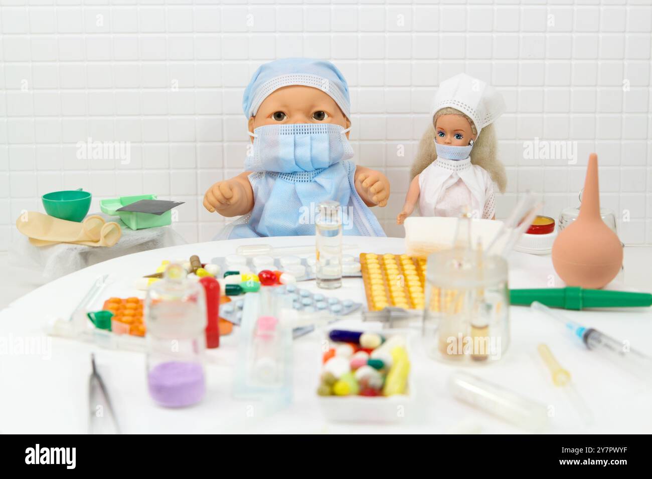 Toys medical scene. Doctor and nurse during working hours at table with ...