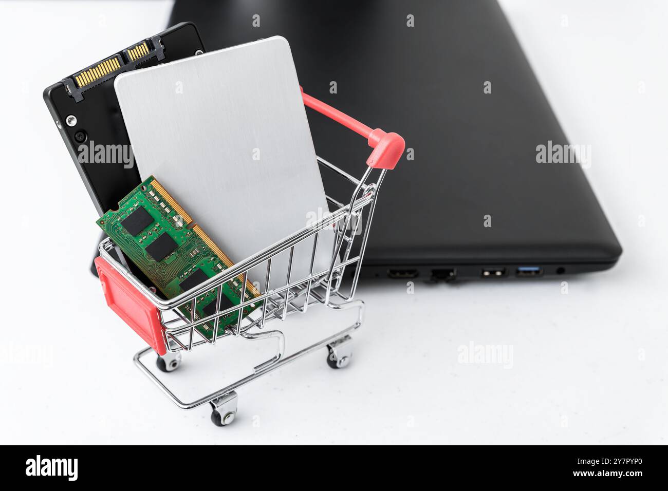 Closed-up view of computer parts in a shopping cart. Computer laptop ...