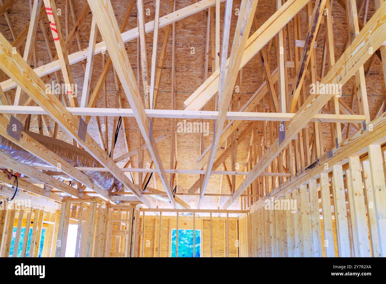 Silver insulation ventilation pipes installing on ceiling attic during ...