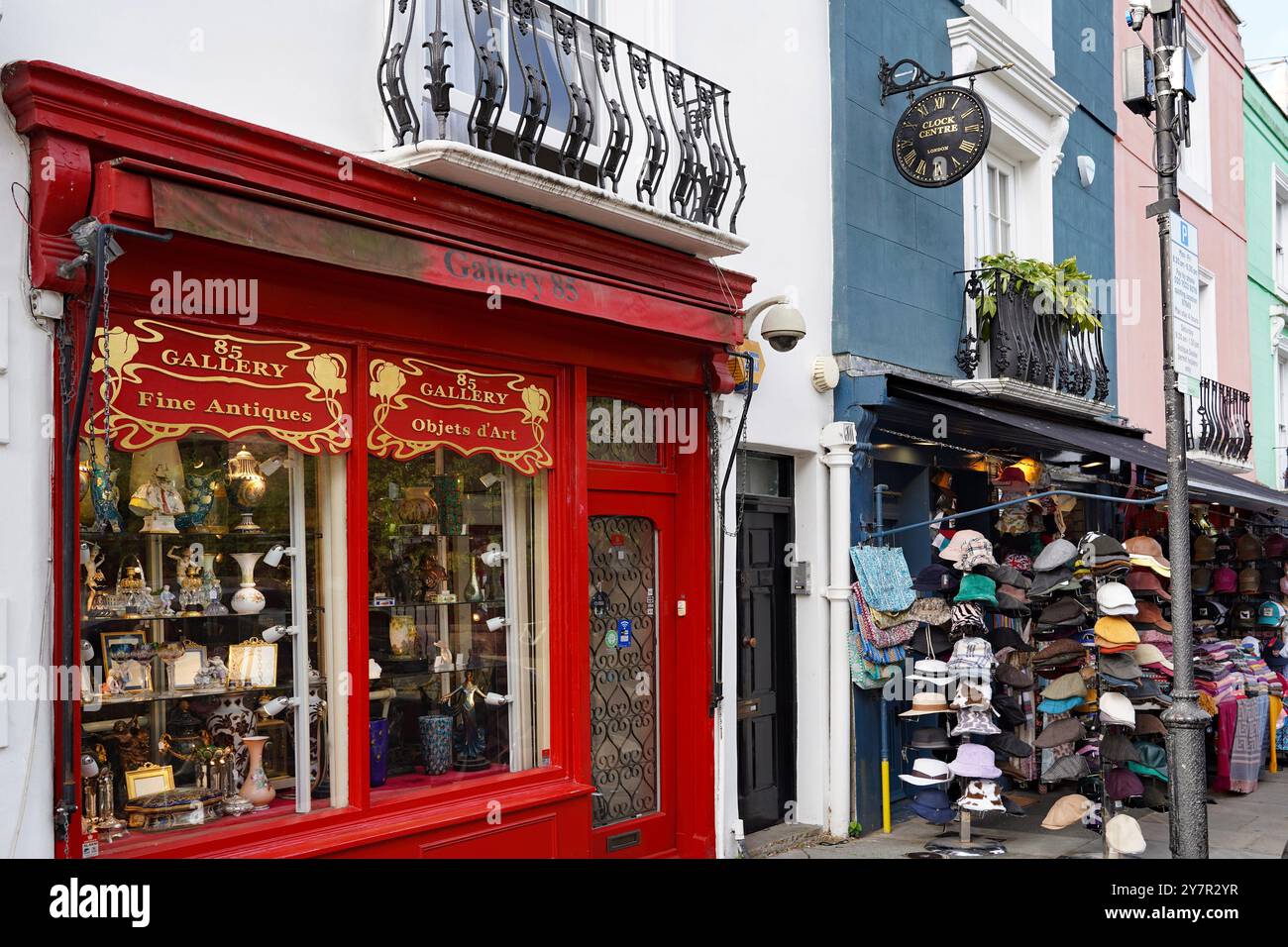 Colorful stores with outdoor tables in Portobello Road Stock Photo - Alamy