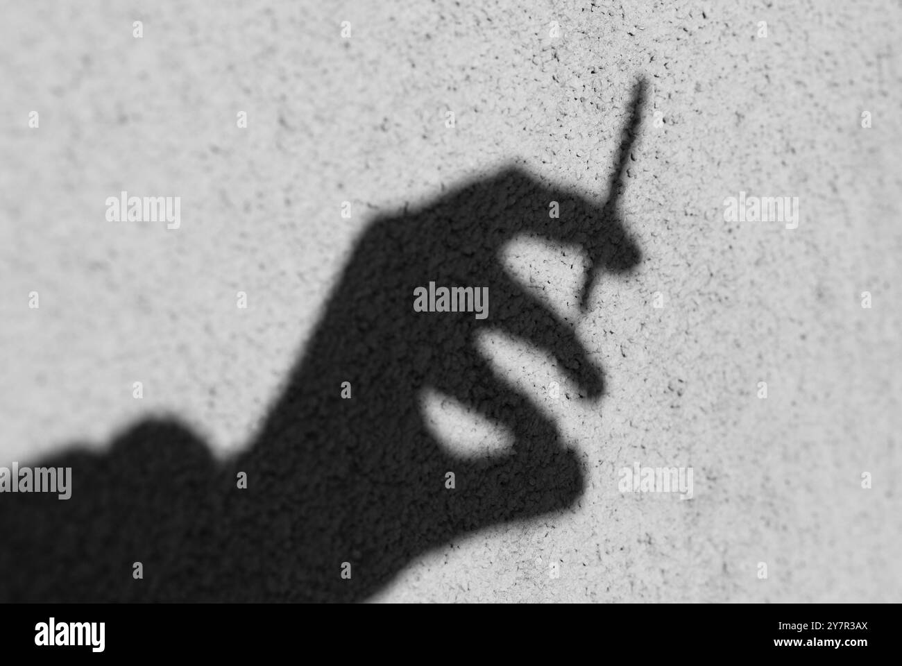 Shadow of a hand holding a cigarette Stock Photo - Alamy