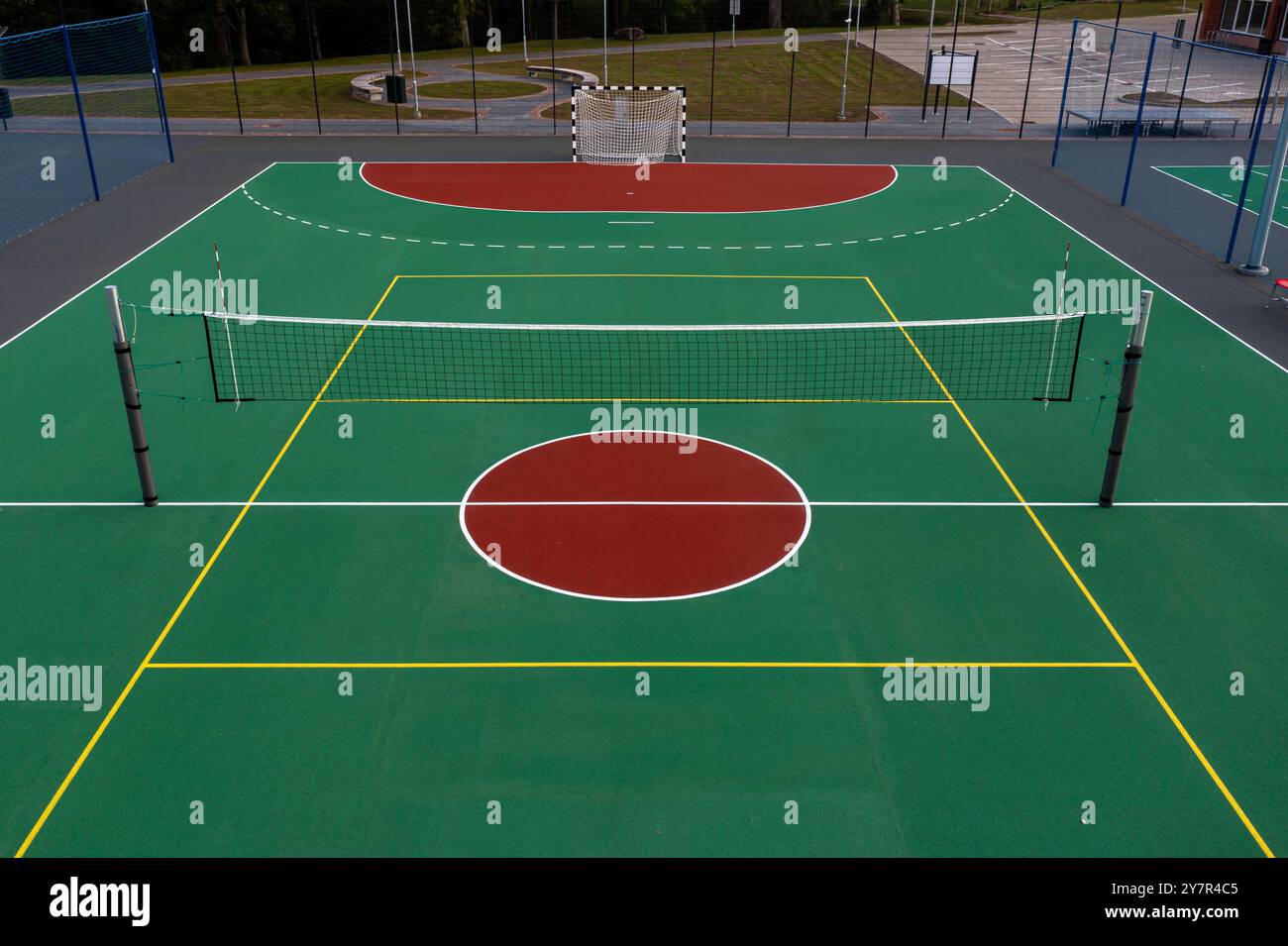 A well-maintained court designed for volleyball and handball, showing ...