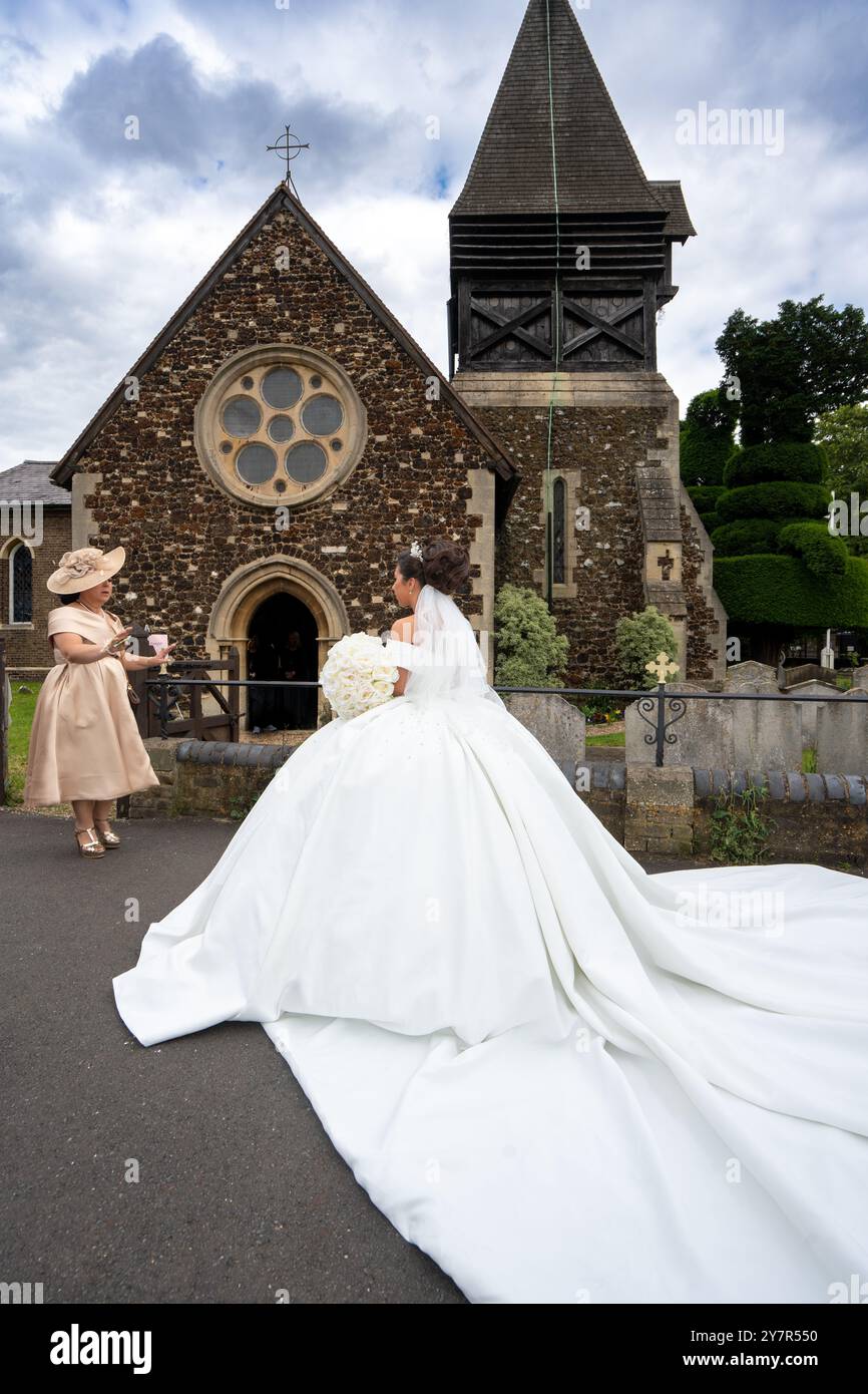 A bride wearing a large wedding dress at a church. Photo date: Friday ...