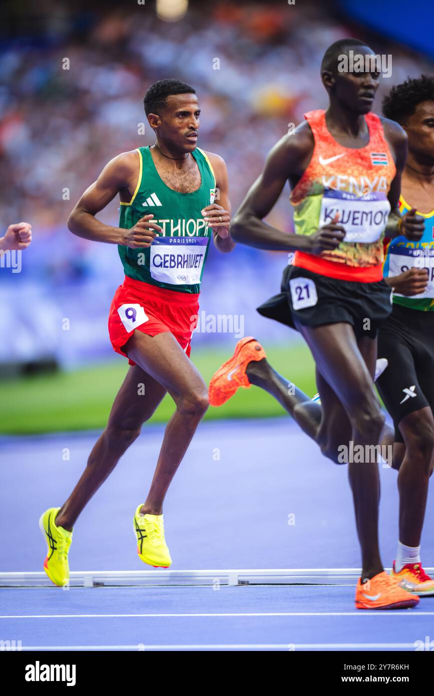Hagos Gebrhiwet participating in the 5000 meters at the Paris 2024 ...