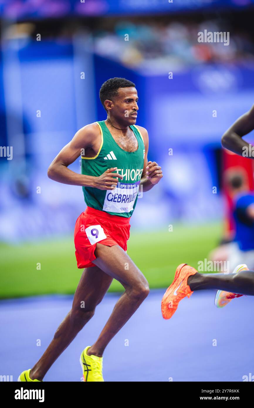 Hagos Gebrhiwet participating in the 5000 meters at the Paris 2024 ...