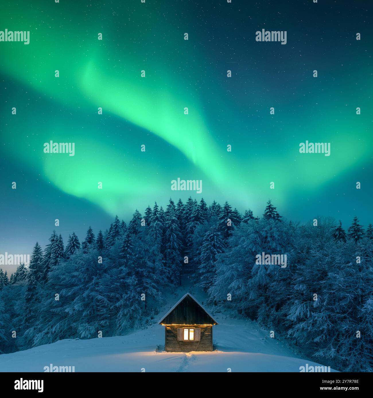 Fairy winter landscape with cozy wooden cabin in snowy forest and ...