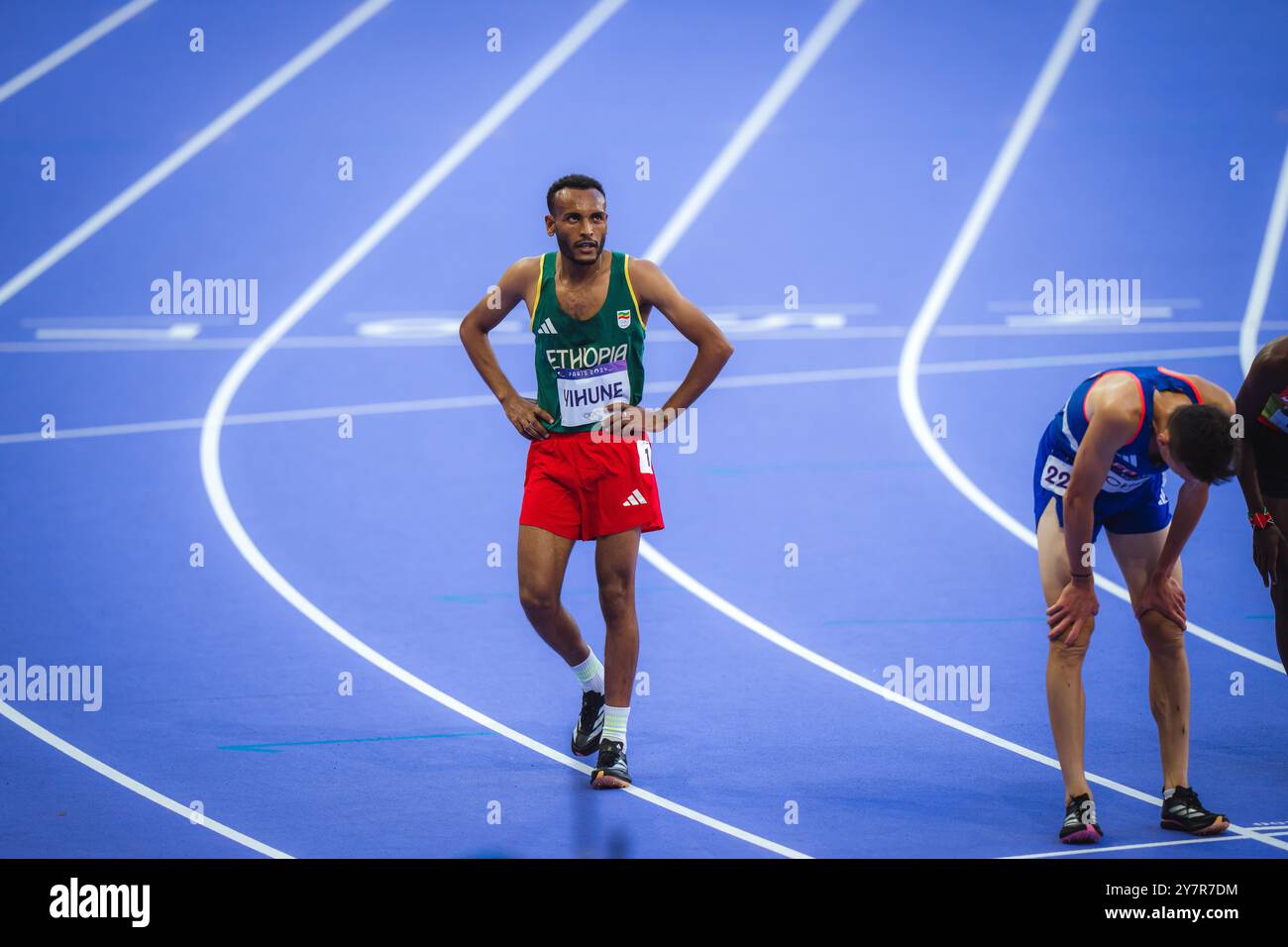 Addisu Yihune participating in the 5000 meters at the Paris 2024 ...