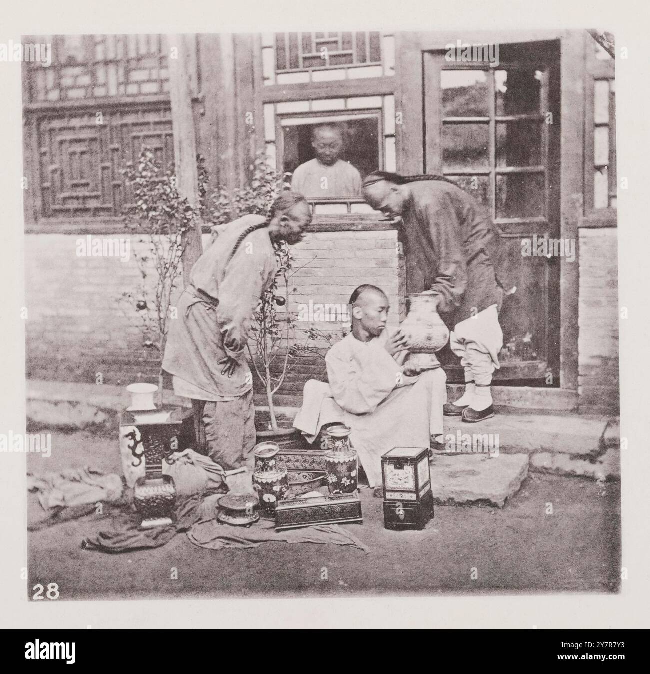 Vintage photo of a Chinese tradsmen selling a selection of vases on the ...