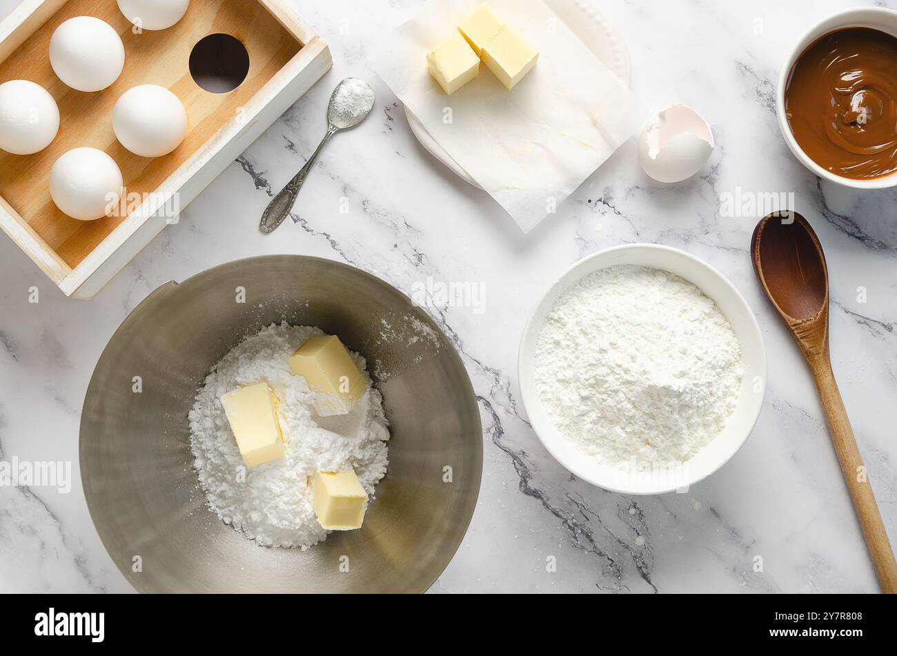 Making cookies and corn starch alfajores. Eggs, butter, corn starch ...