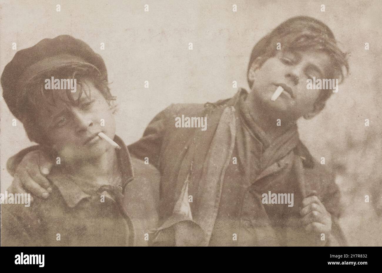 Vintage photo of two boys posing with cigarettes. Photographic postcard ...