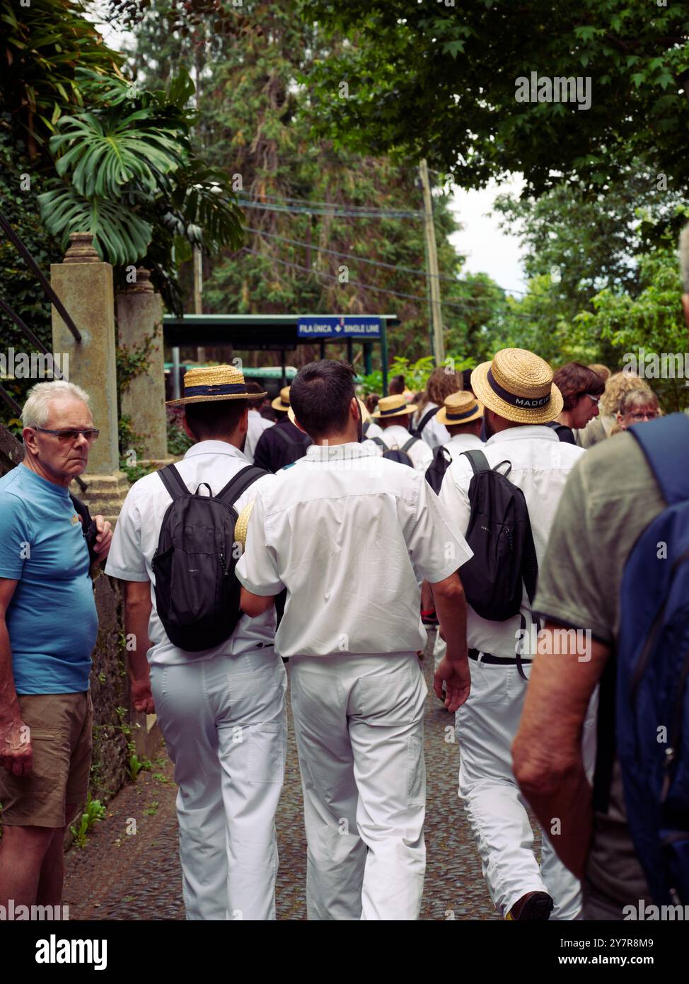 Group of carreiros walking toward the single line queue, ready for the ...