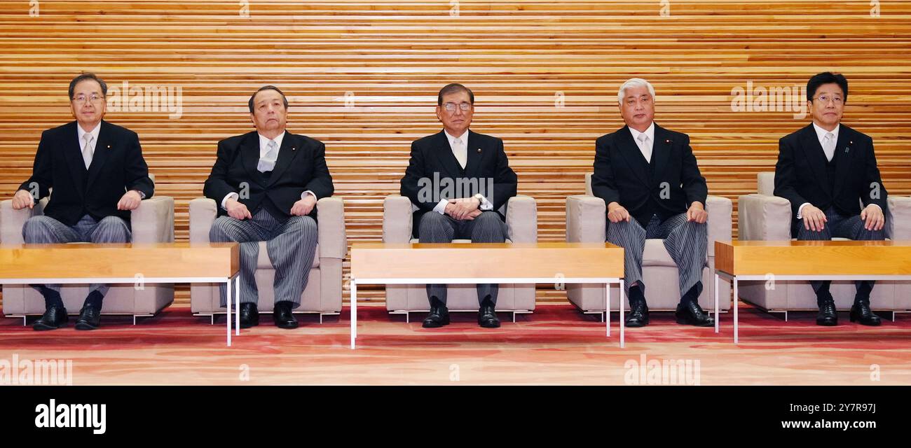 New Japanese prime minister Shigeru Ishiba (C) attends a first cabinet ...
