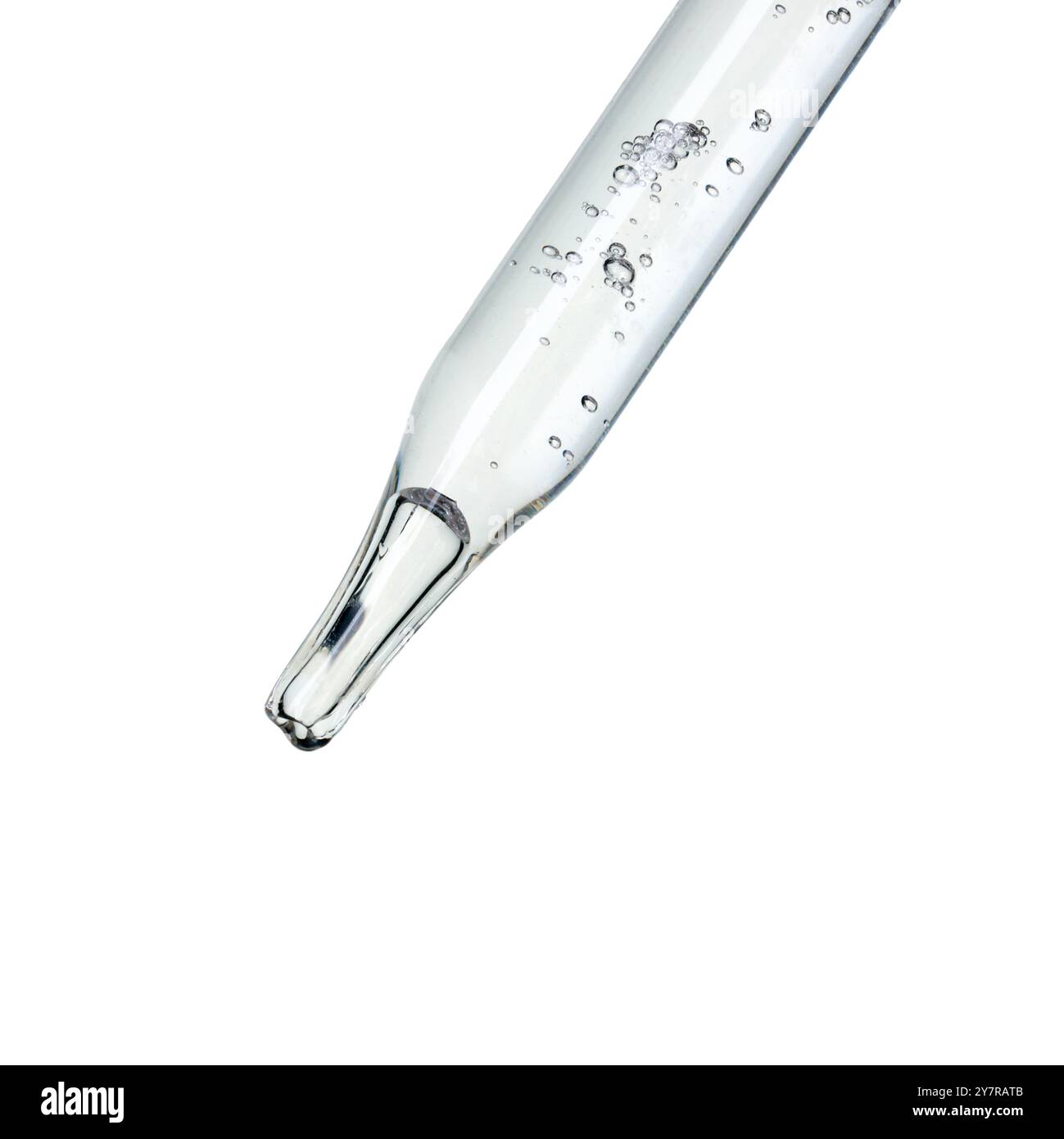Dripping cosmetic serum from pipette on white background Stock Photo ...