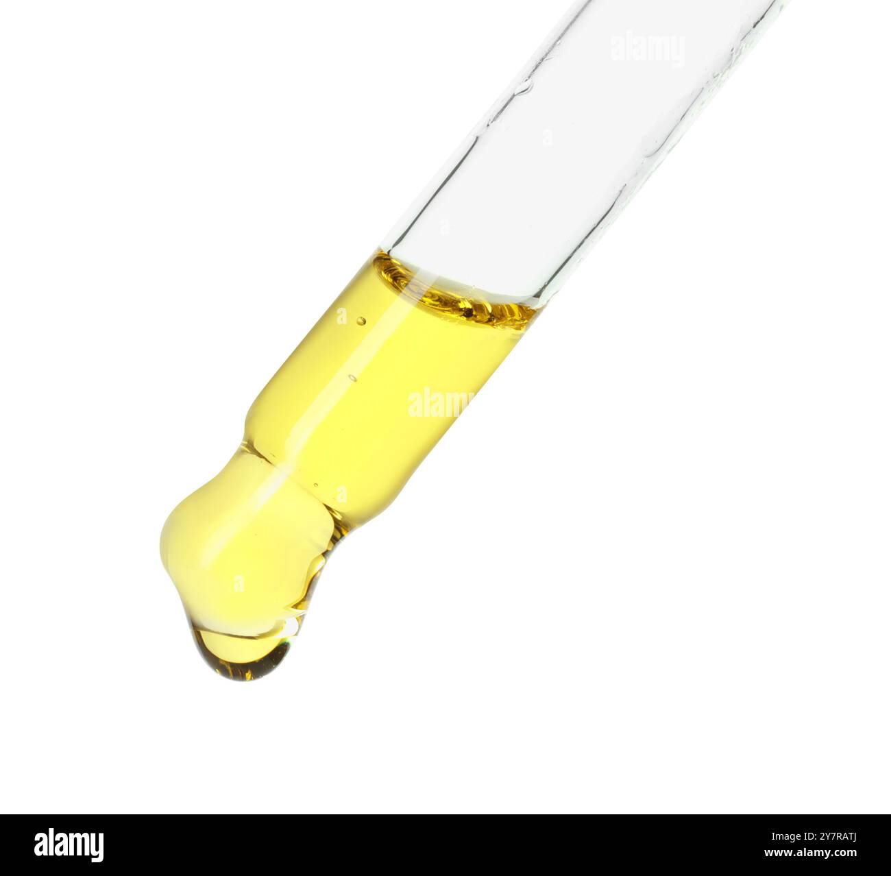 Dripping essential oil from pipette on white background Stock Photo - Alamy
