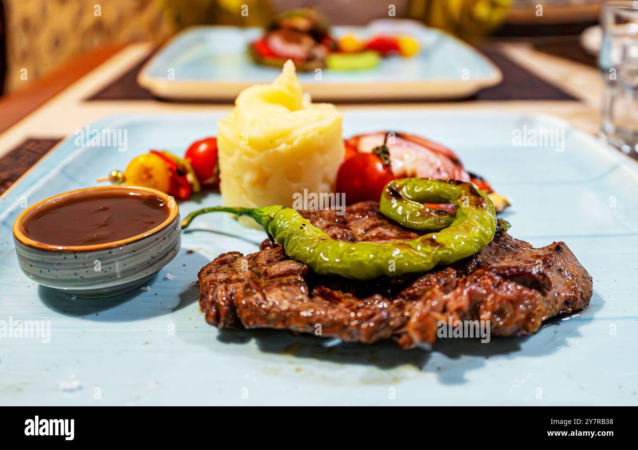 Beef entrecote with mashed potatoes in a restaurant Stock Photo - Alamy