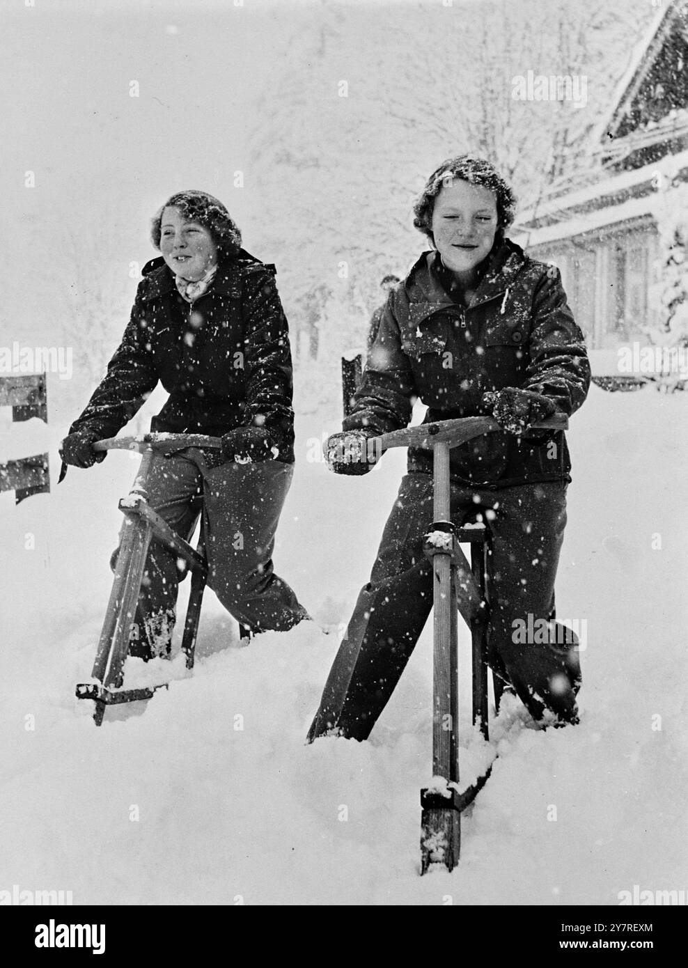Dutch princesses play in the snow. On December 30, 1953, Crown Princess ...