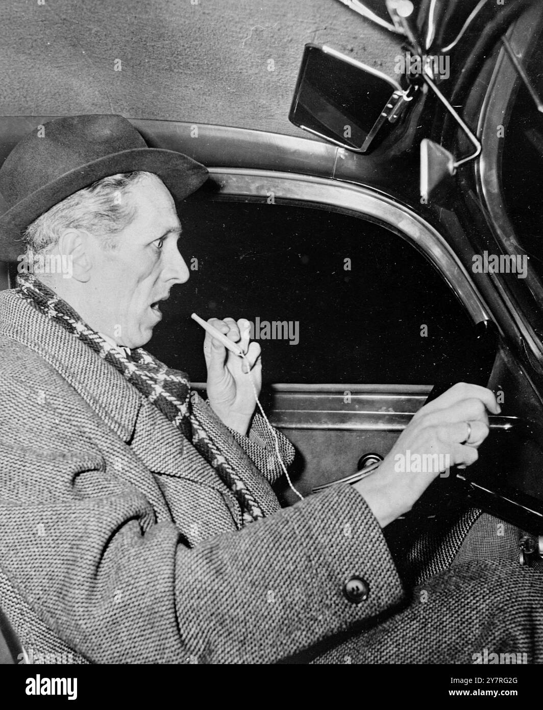 Smoking keeps the driver awake. 2.12.53 A cigarette holder attached to ...
