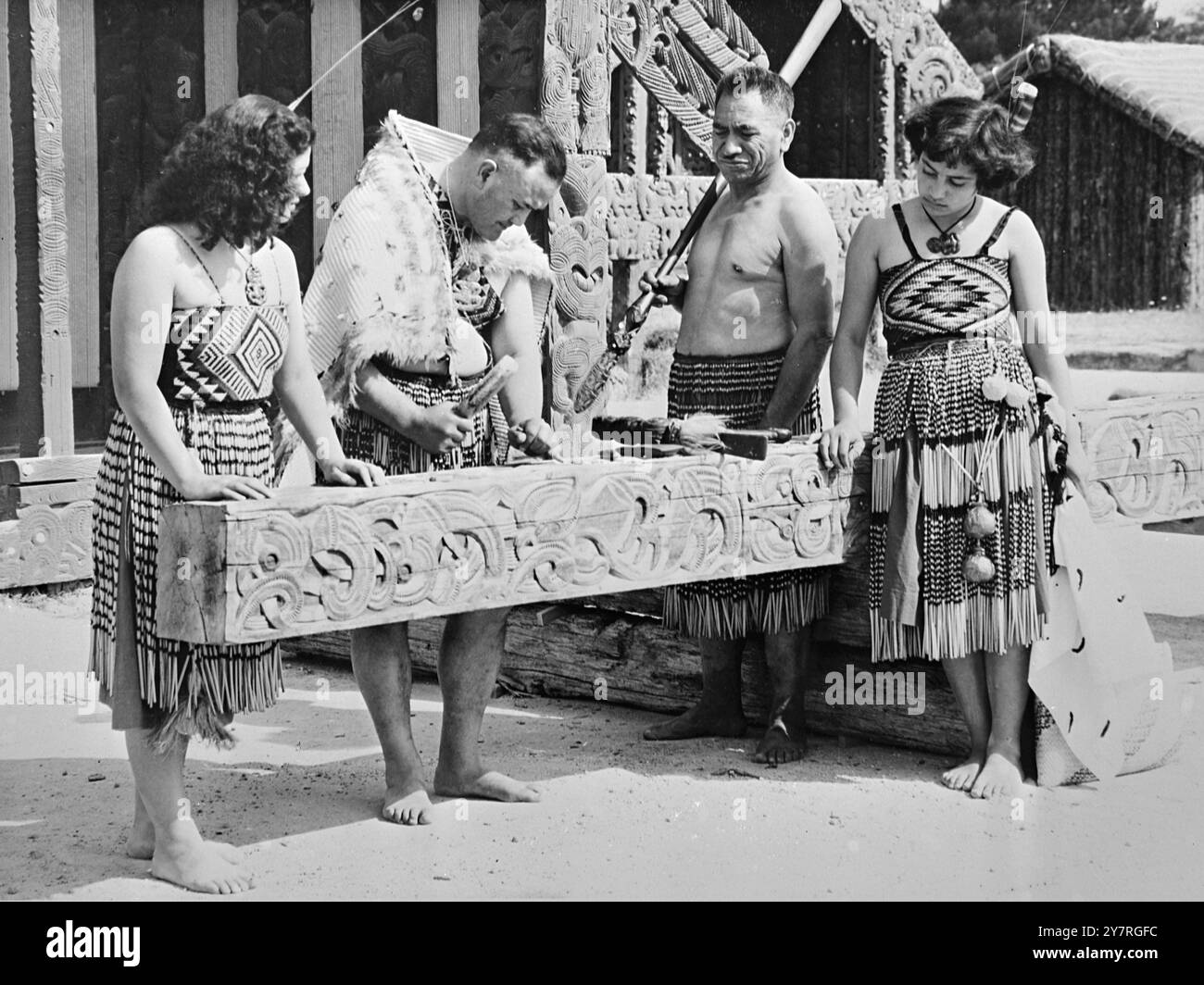 Maoris carving with bone and stone. The Queen and the Duke of Edinburgh ...