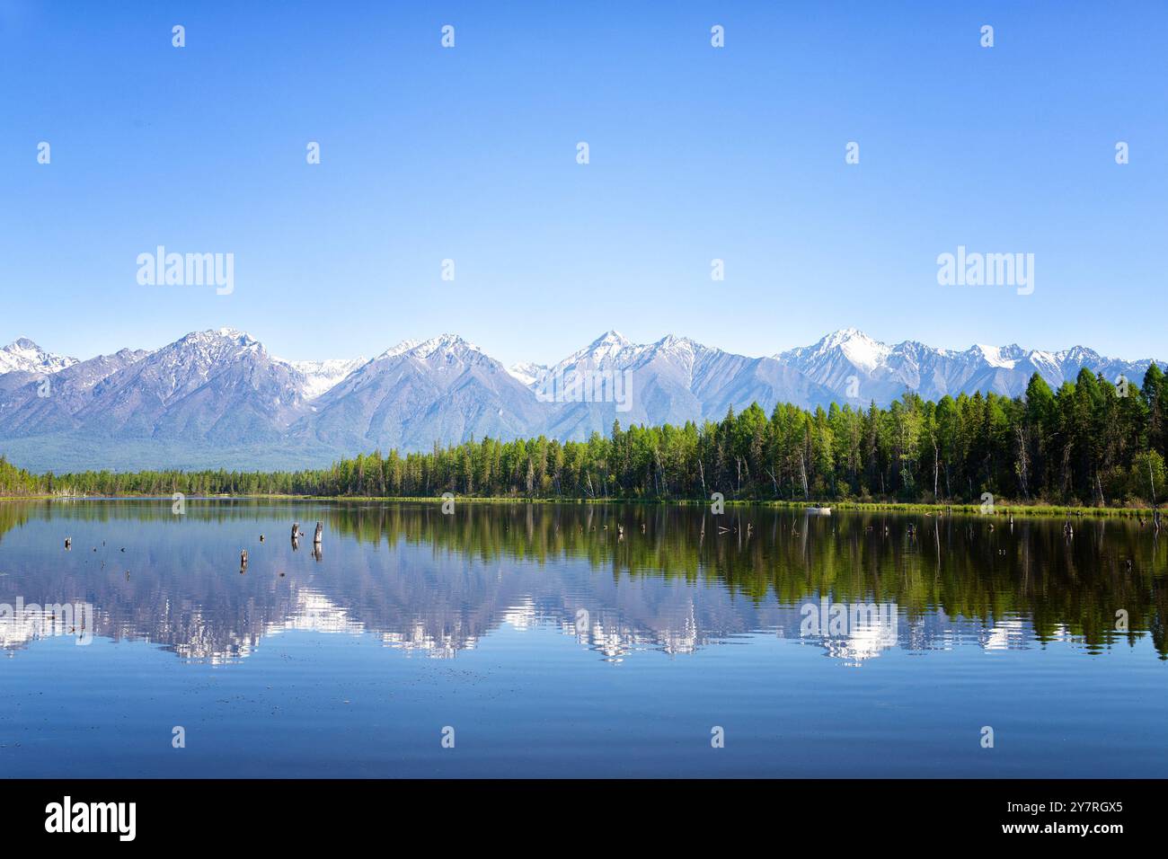 Russia. Landscape with mountains reflecting in the water on summer day ...