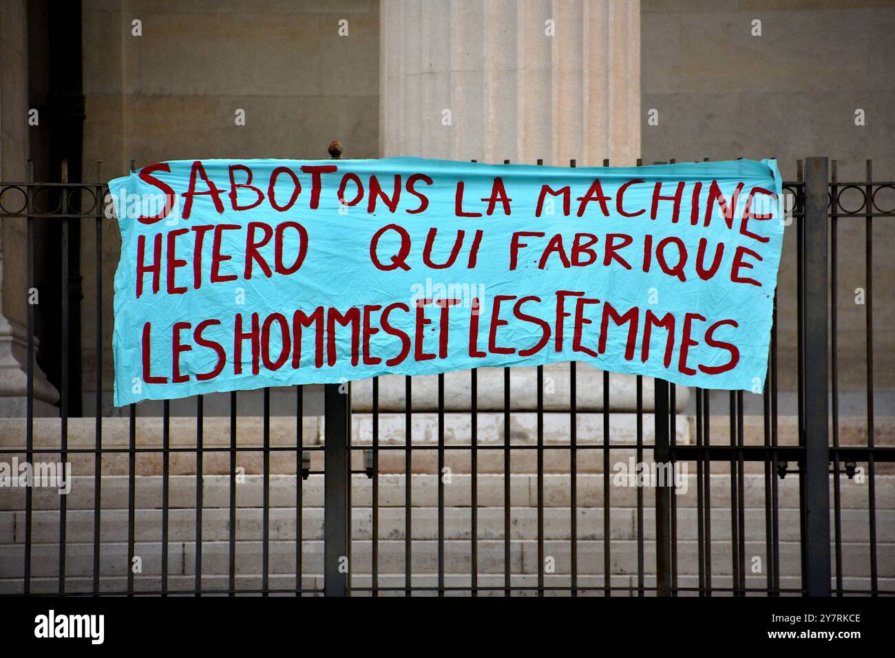 A banner seen hang on the gates of the courthouse. Before starting a ...