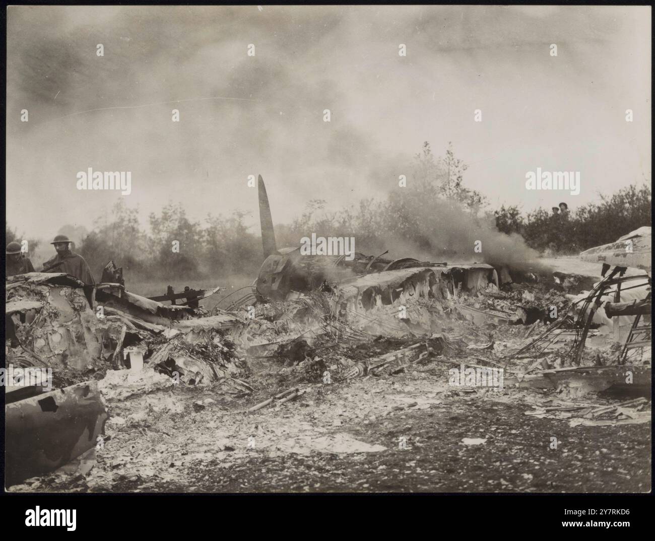 GERMAN PLANE ENDS UP IN BITS. PHOTO SHOWS: The scattered wreckage of a ...