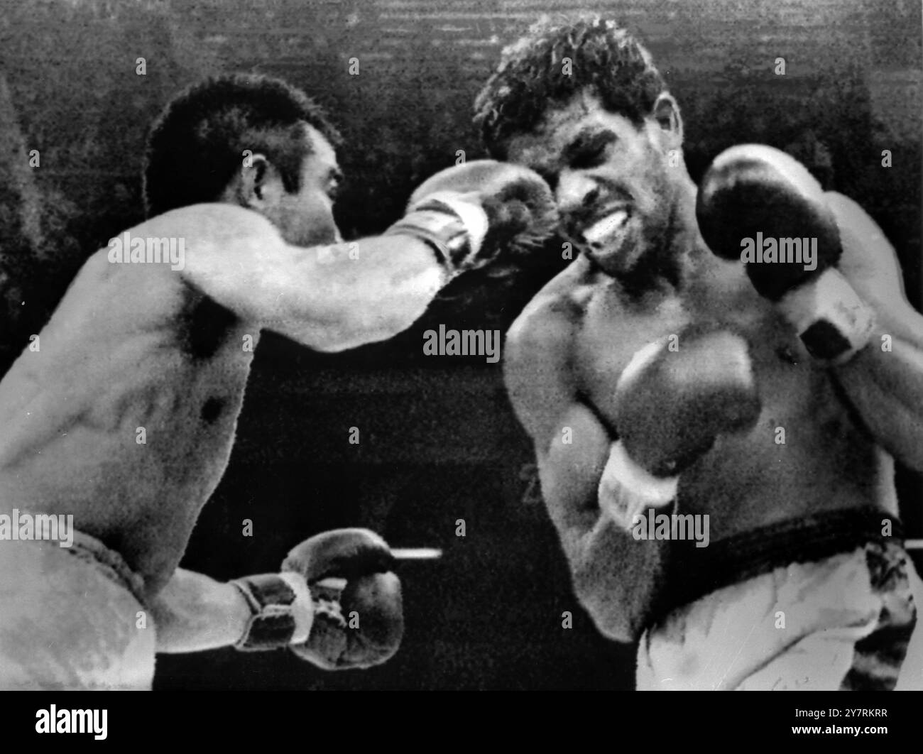 AUSTRALIAN CHALLENGER LIONEL ROSE GRIMACES AS HE GETS A RIGHT TO THE ...