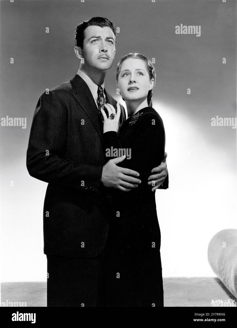 ROBERT TAYLOR and NORMA SHEARER publicity portrait in ESCAPE 1940 director MERVYN LeROY novel ...