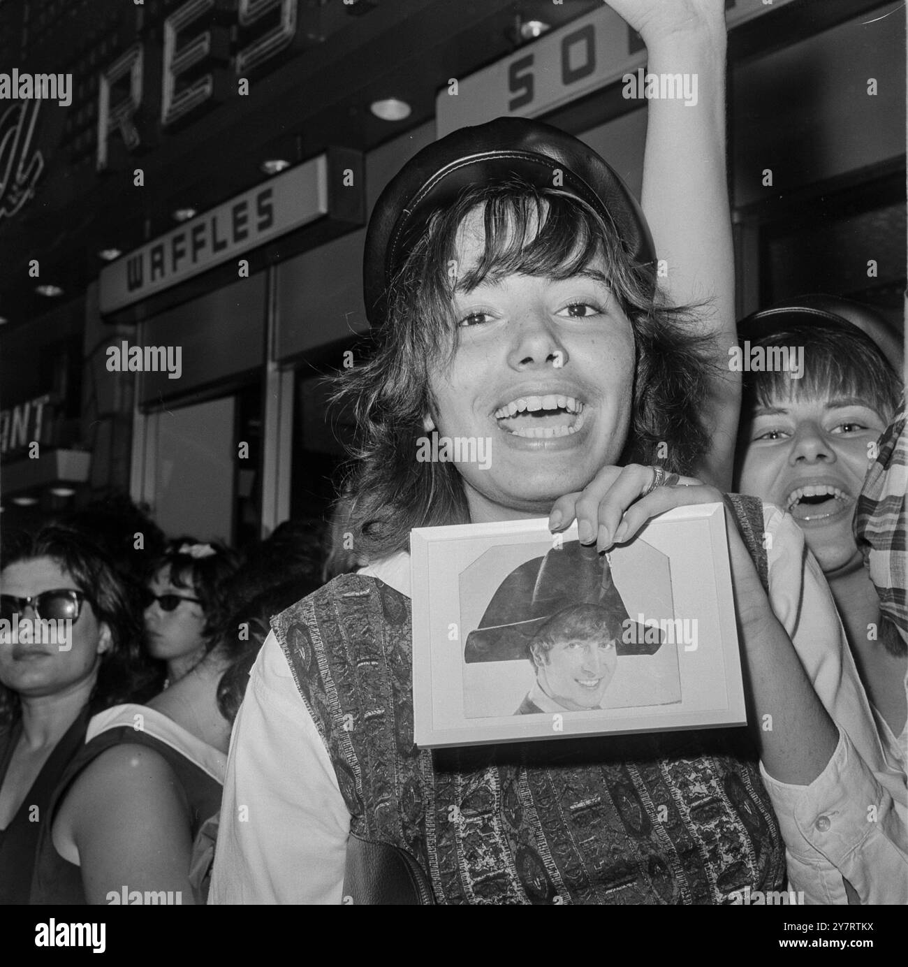 BEATLE FANS GATHER IN FRONT OF THE ASTOR THEATRE ON BROADWAY AND 45TH ...