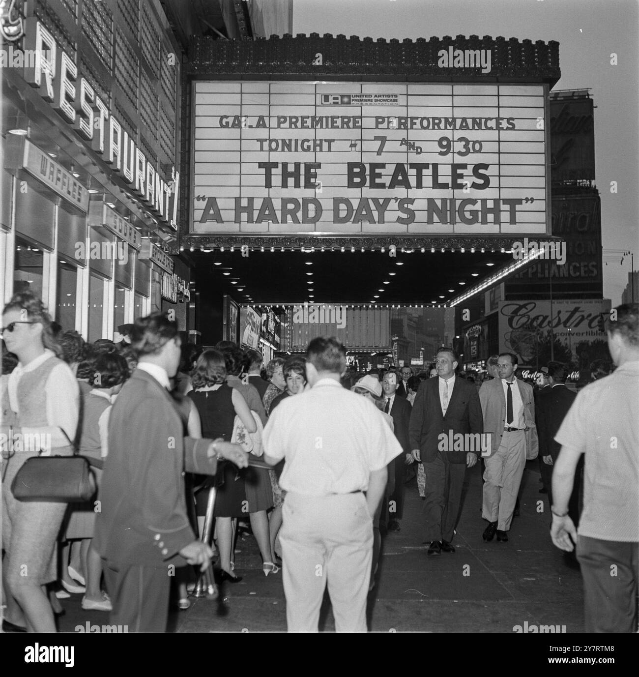BEATLE FANS GATHER IN FRONT OF THE ASTOR THEATRE ON BROADWAY AND 45TH ...