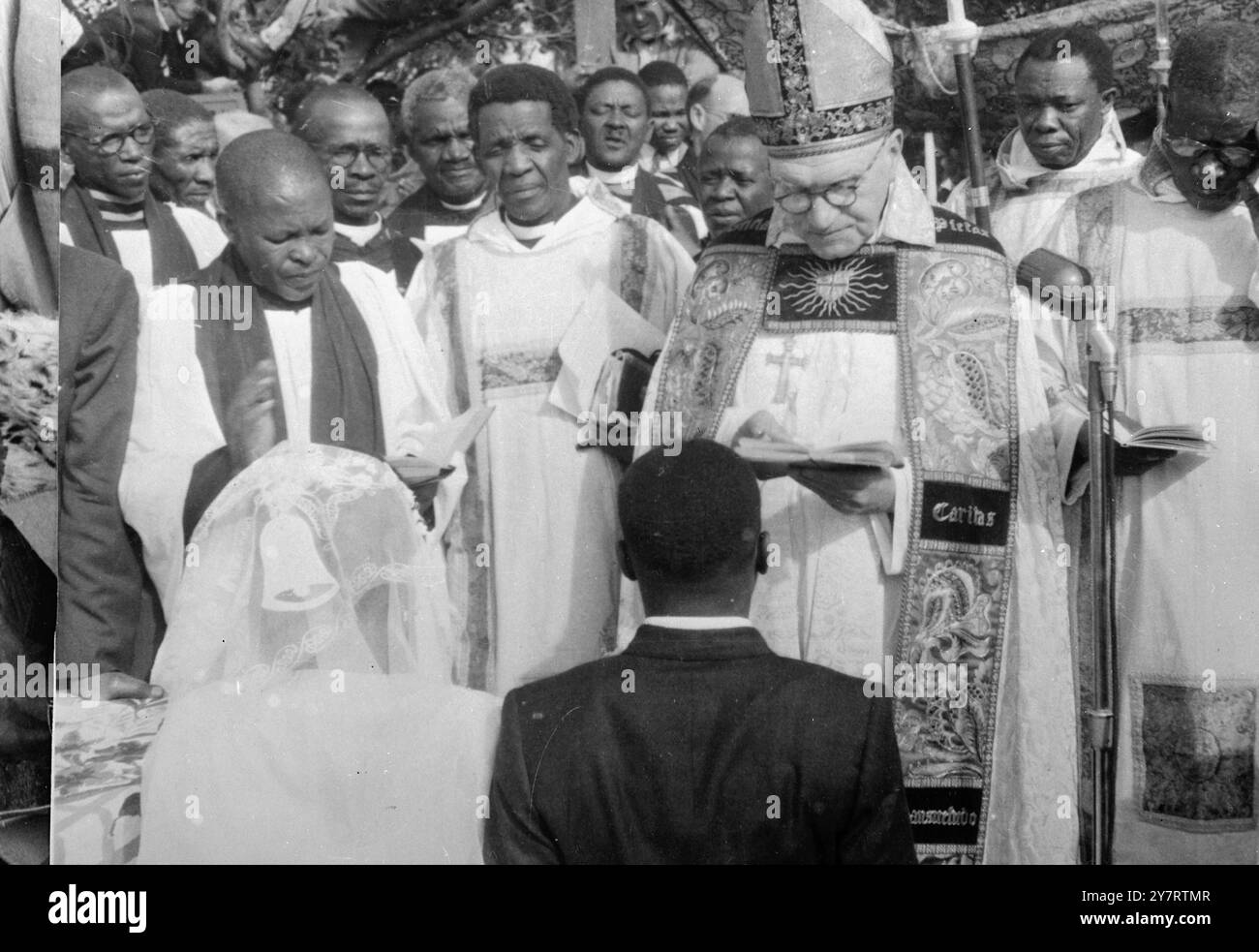 THOUSANDS CROWD ALTAR AS CHILDREN OF NATIVE CHIEFS WED 13.7.53 ...