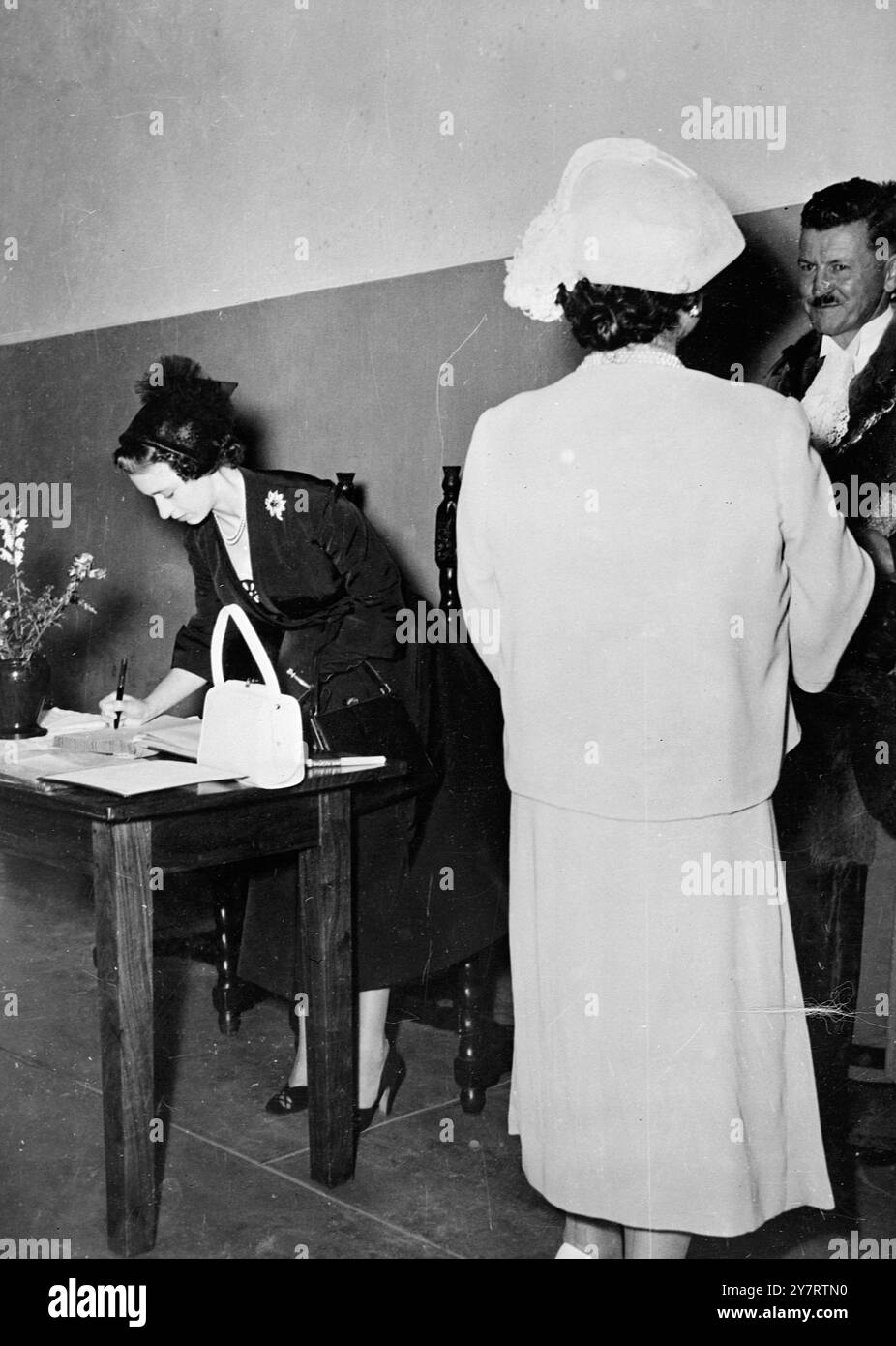 ROYAL VISIT TO RHODESIA 12.7.53Princess Margaret signs the visitors ...