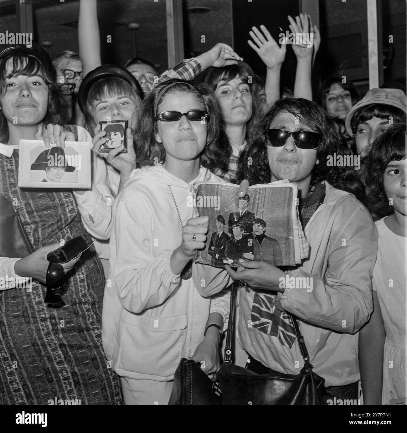 BEATLE FANS GATHER IN FRONT OF THE ASTOR THEATRE ON BROADWAY AND 45TH ...