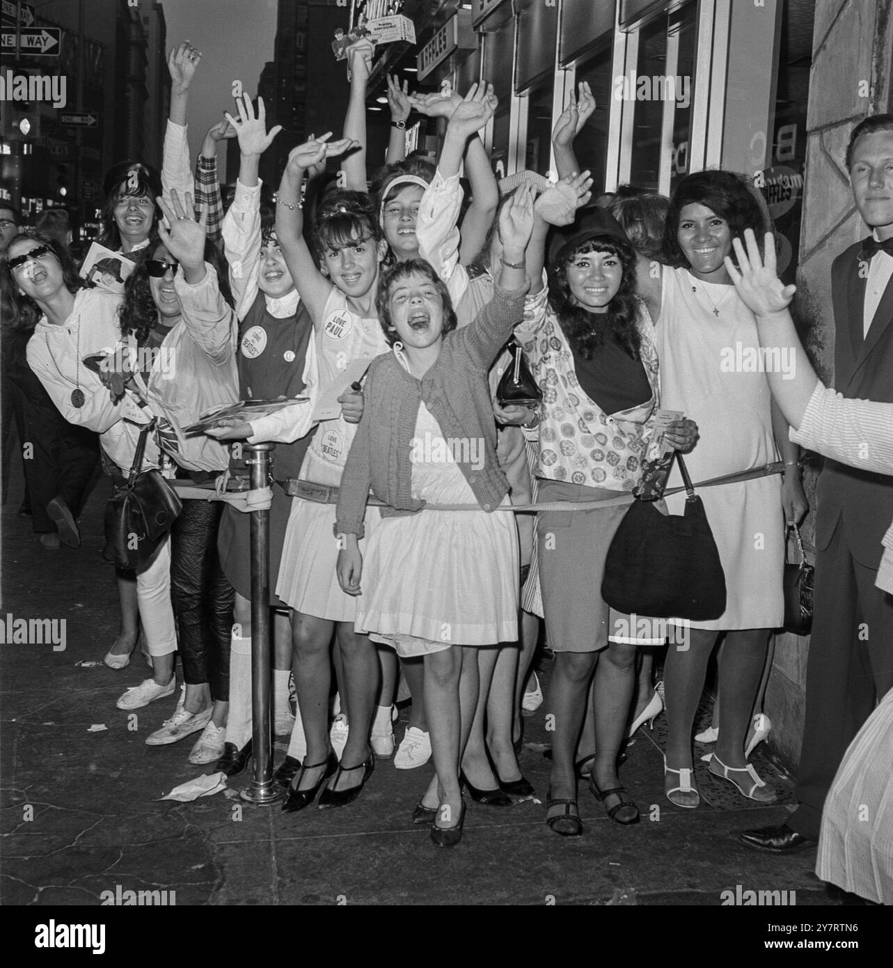 BEATLE FANS GATHER IN FRONT OF THE ASTOR THEATRE ON BROADWAY AND 45TH ...