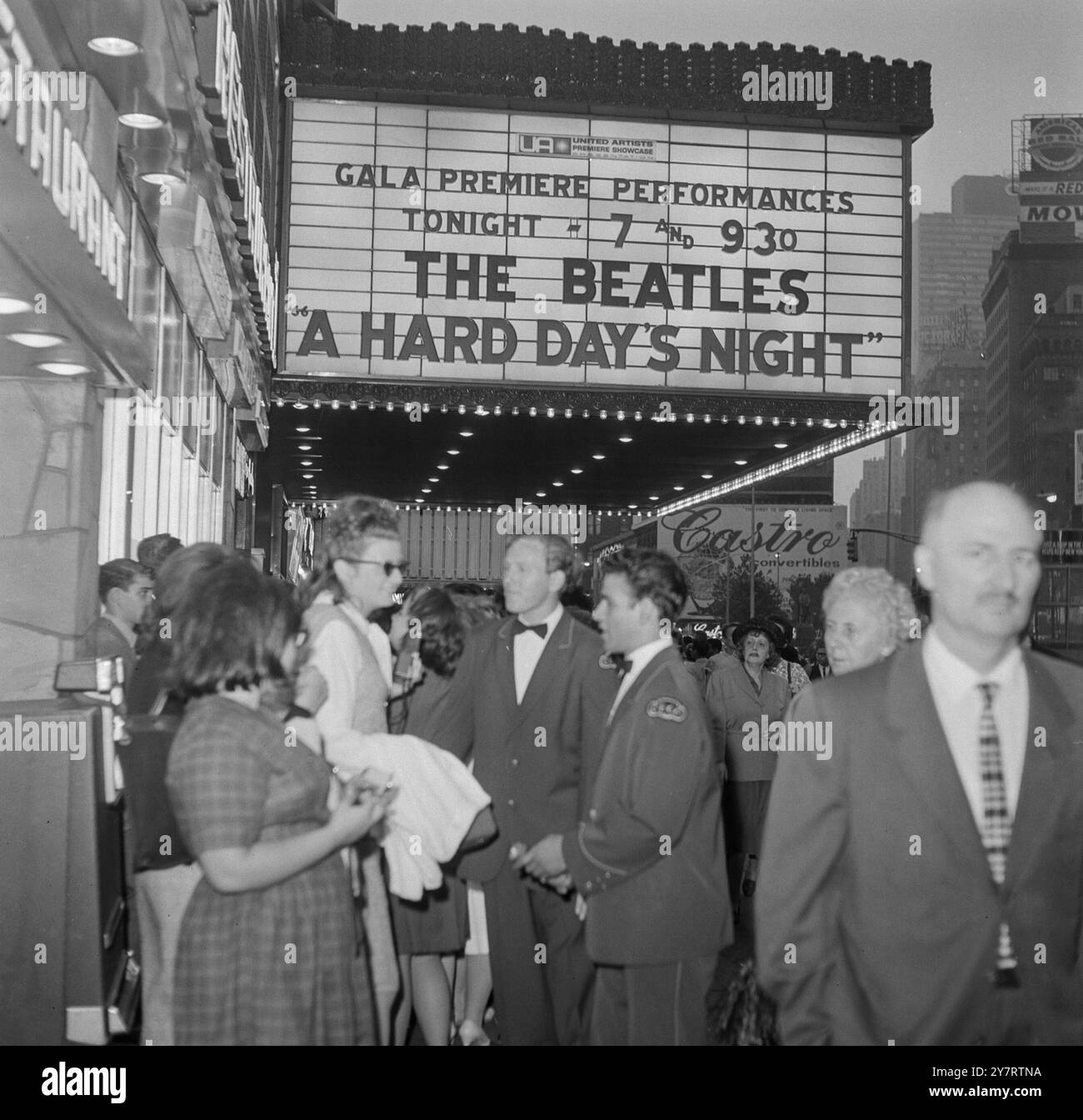 BEATLE FANS GATHER IN FRONT OF THE ASTOR THEATRE ON BROADWAY AND 45TH ...