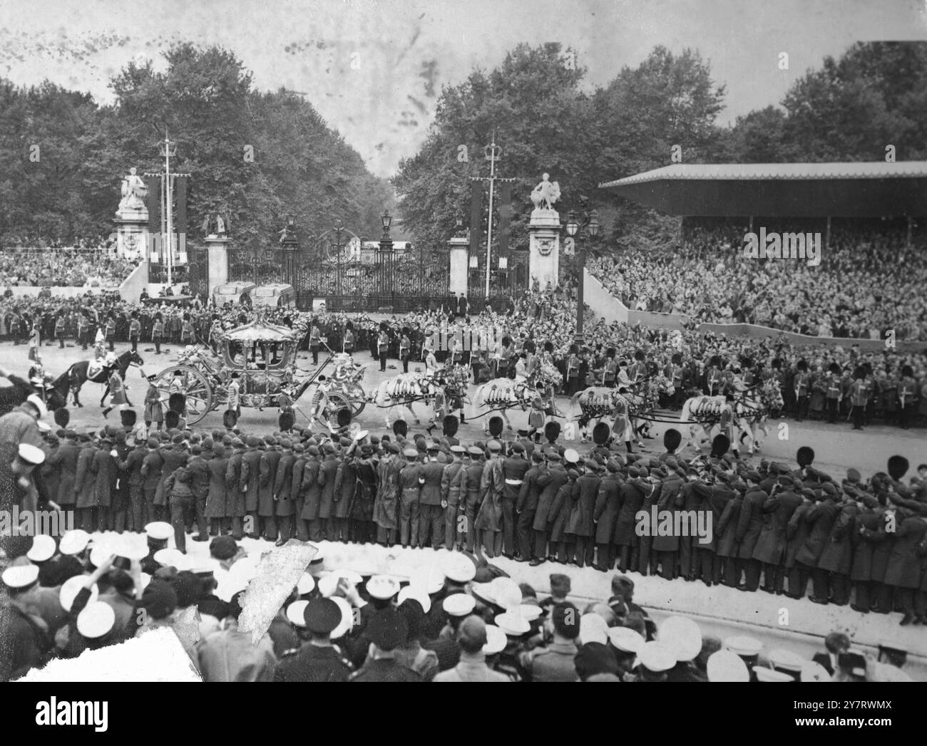 Coronation of Queen Elizabeth II, showing crowds of people watching as ...