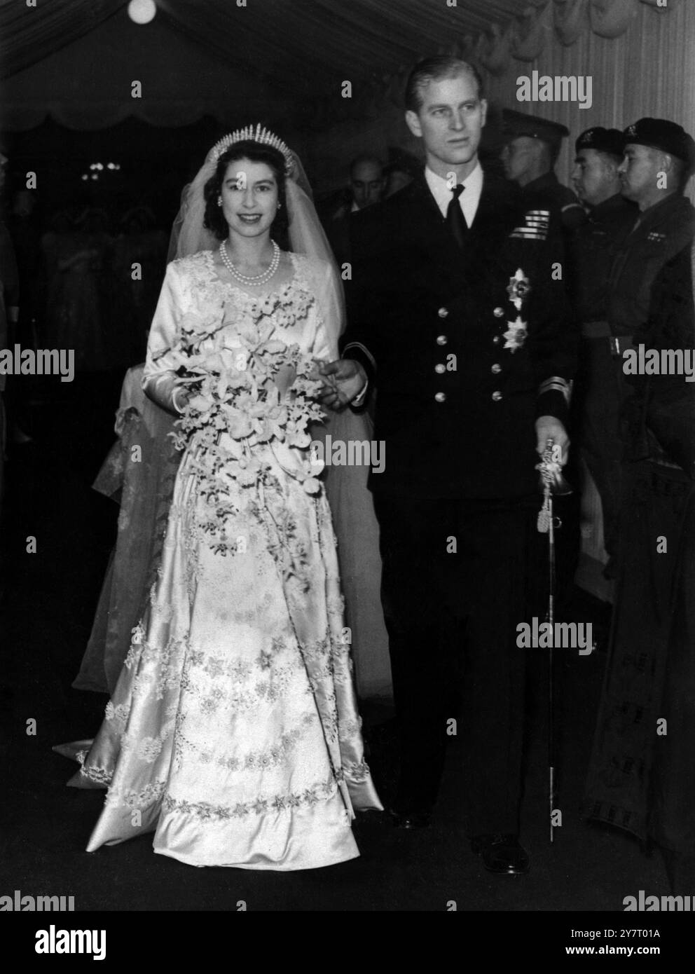 Princess Elizavbeth and Prince Philip flanked by a Guard of Honour leaving Westminster Abbey ...