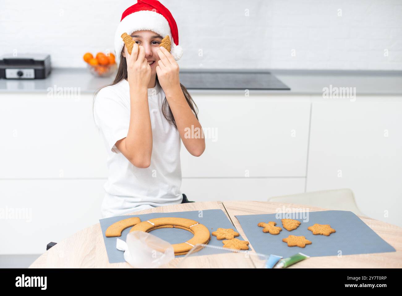 kids baking christmas cookies before the celebration of Christmas ...