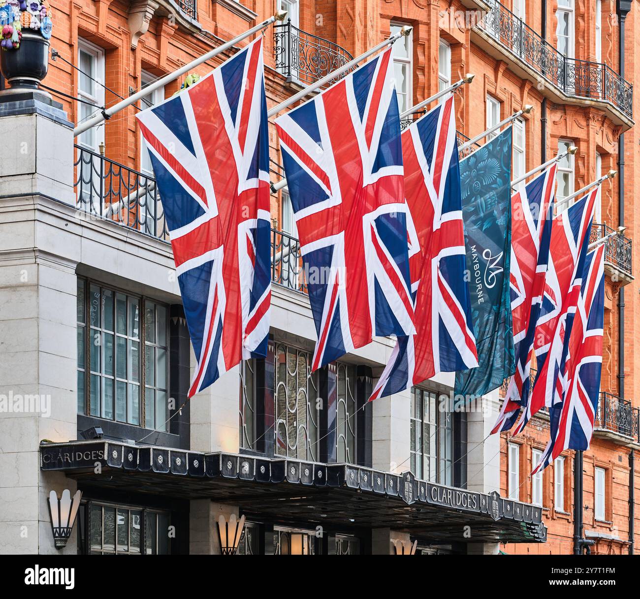 Union Jack flags outside the main entrance to Claridge's Hotel, Mayfair, London, England Stock ...
