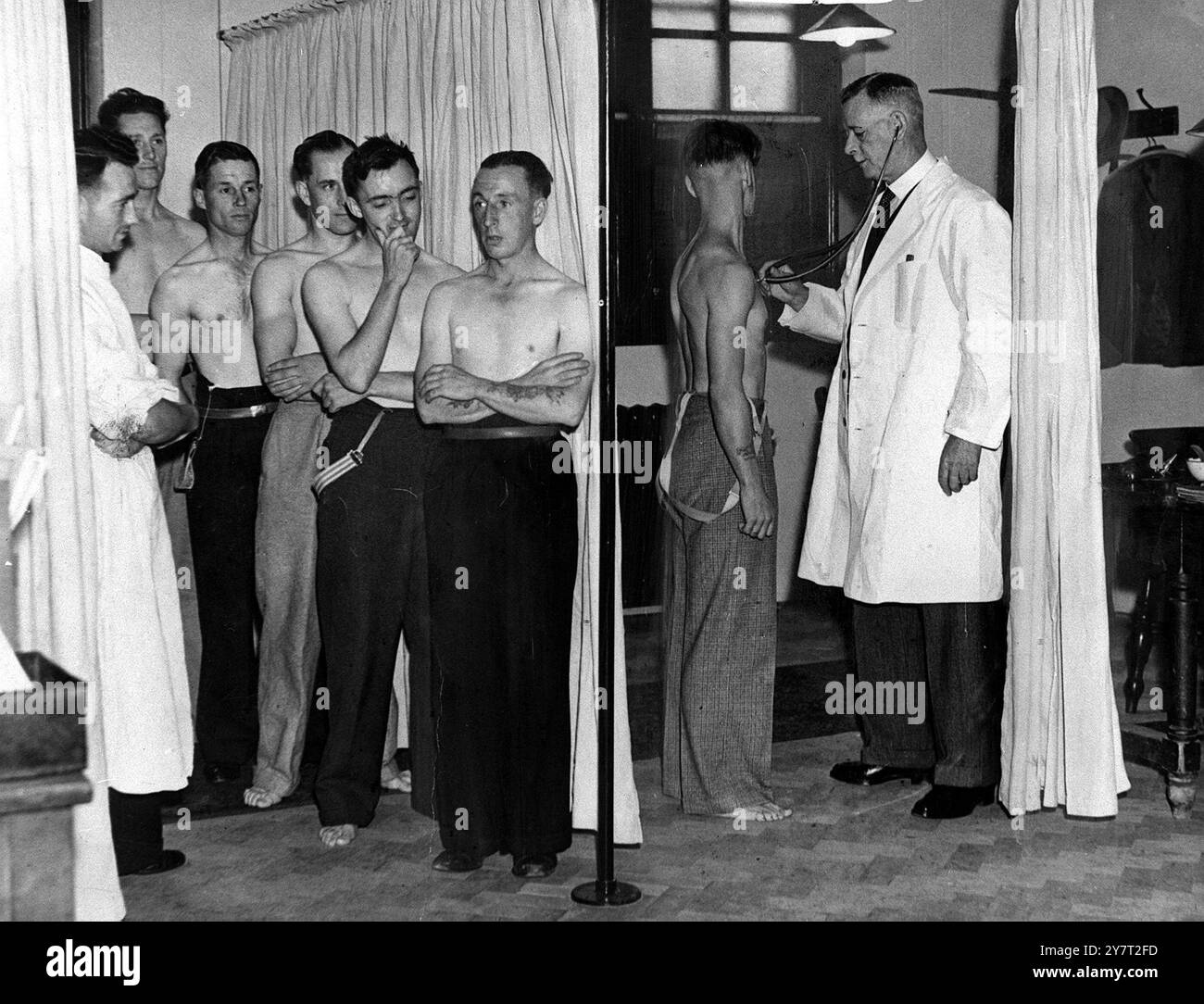 MEDICAL INSPECTON: British Army recruits wait in line before their ...