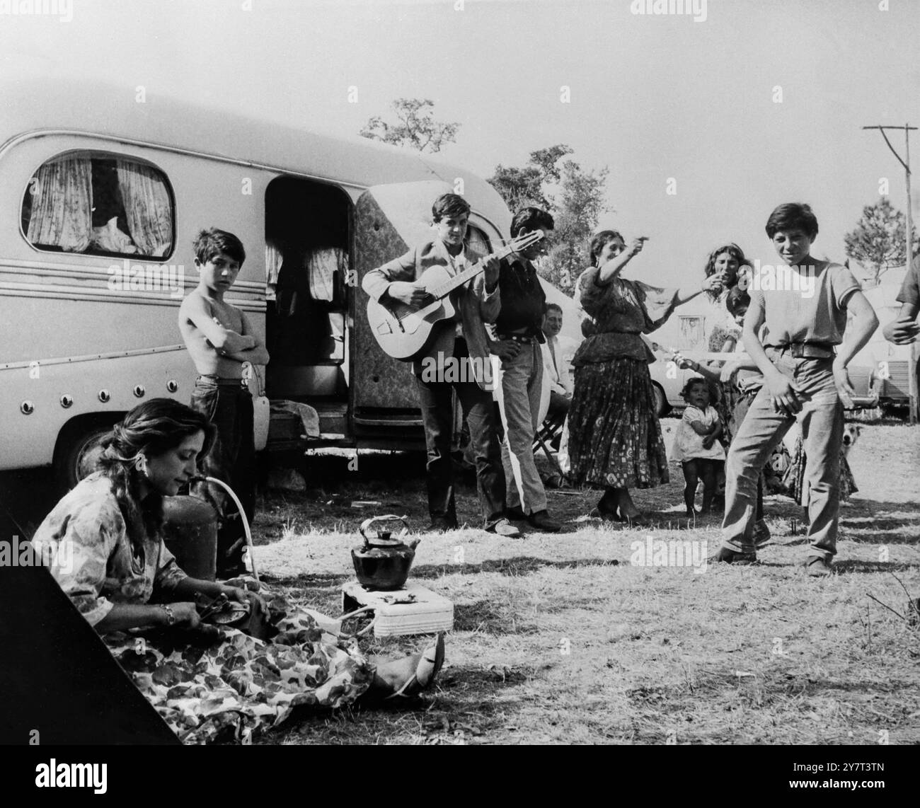 ROMA AWAIT THE POPE : POMEZIA , ITALY : A group of Roma people play ...