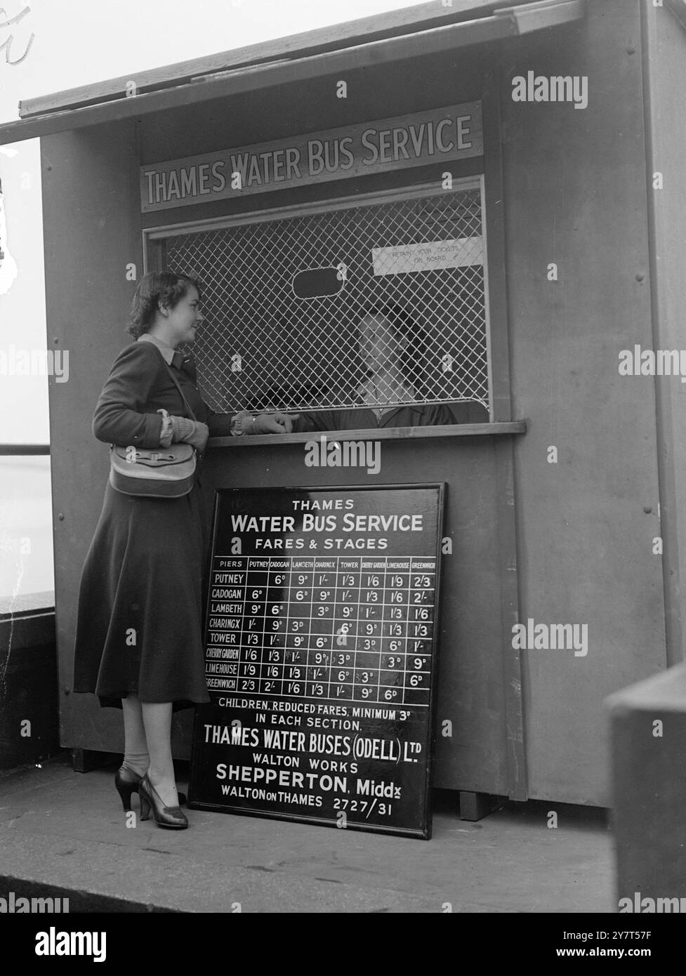 THIS WAY FOR THE WATER BUS A woman passenger for the Thames Water Bus ...