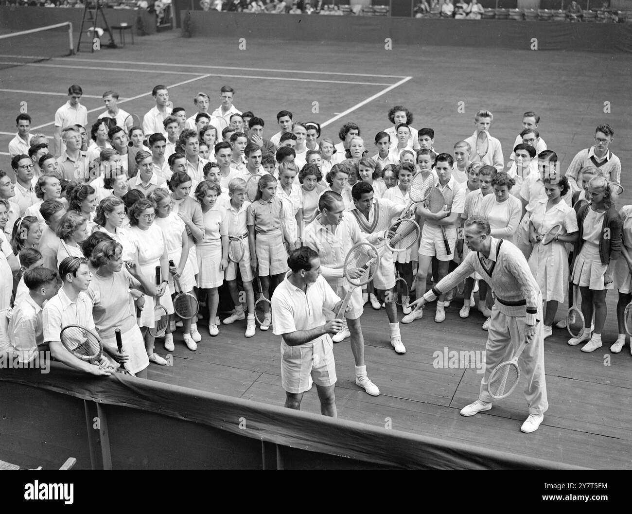 TENNIS STARS COACH YOUTHFUL PLAYERS Four famous lawn tennis players who ...