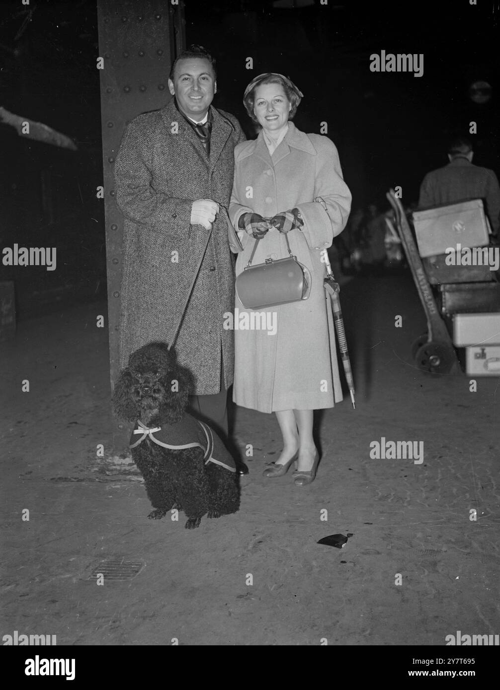 WRAPPED POODLE American singer ALLAN JONES with his wife and their ...