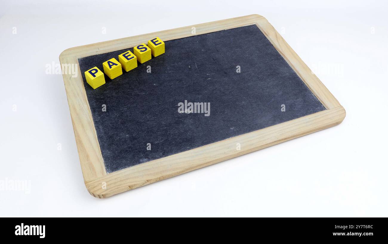 Written "PAESE" in Italian culture with wooden cubes and slate ...
