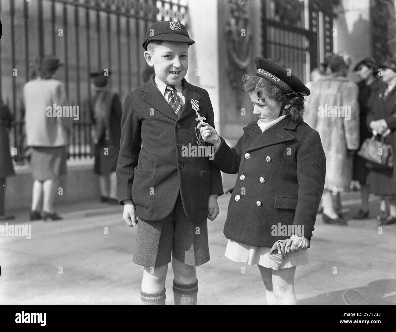 8YR OLD RECEIVES DEAD FATHERS D.F.C. MEDAL 1945 PHOTO SHOWS:- Outside ...